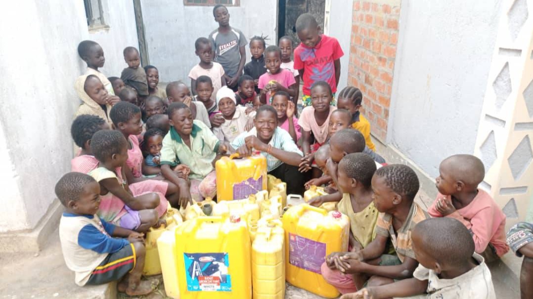 Water fetching / second activity at orphans of Uganda Children Center ... Water fetching / second activity at orphans of Uganda Children Center ...
